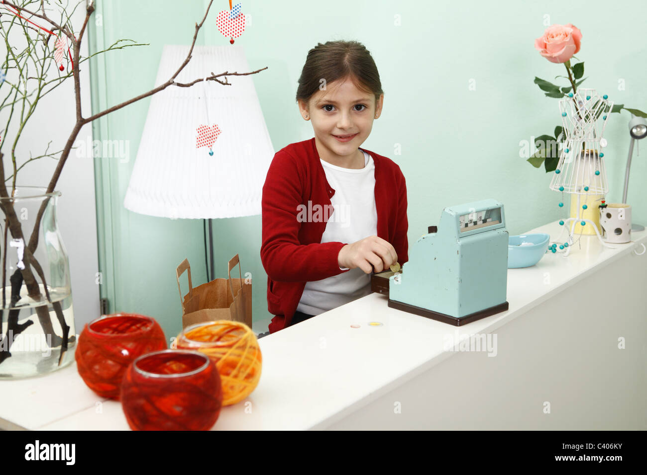 girl working behind shop till Stock Photo - Alamy