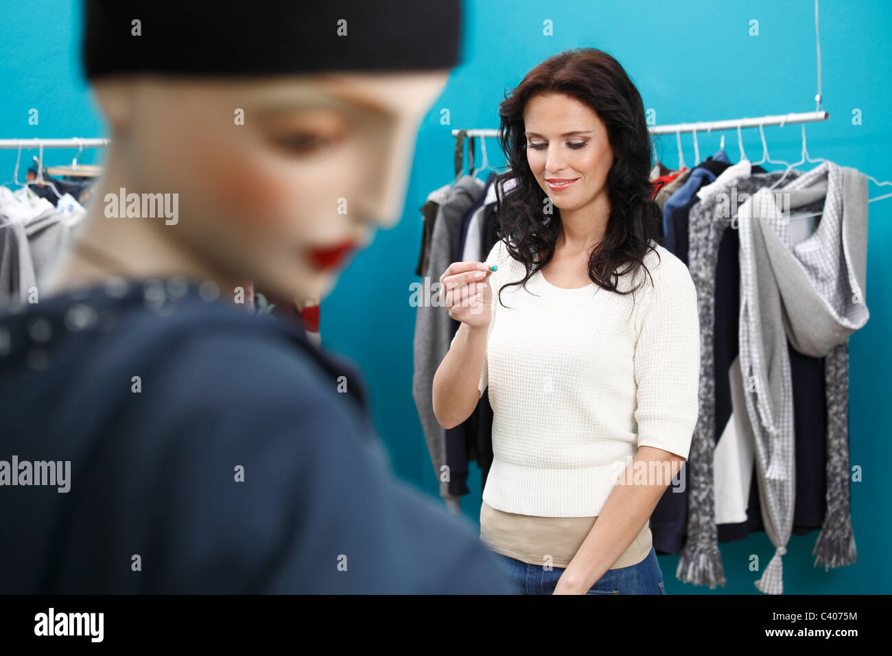 portrait of woman in clothes shop Stock Photo - Alamy