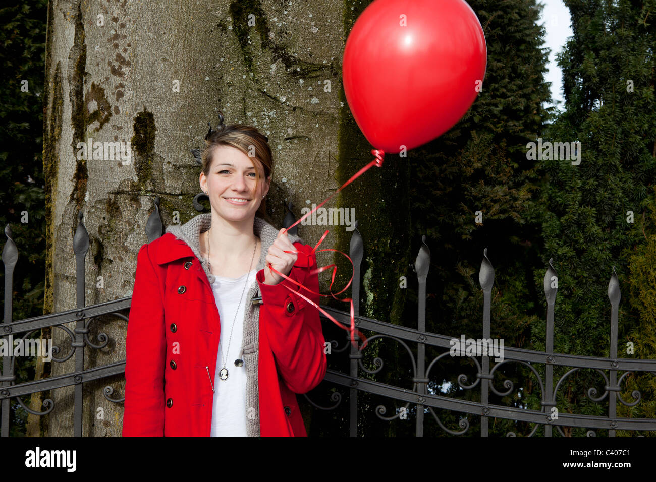 Holding baloon hi-res stock photography and images - Alamy