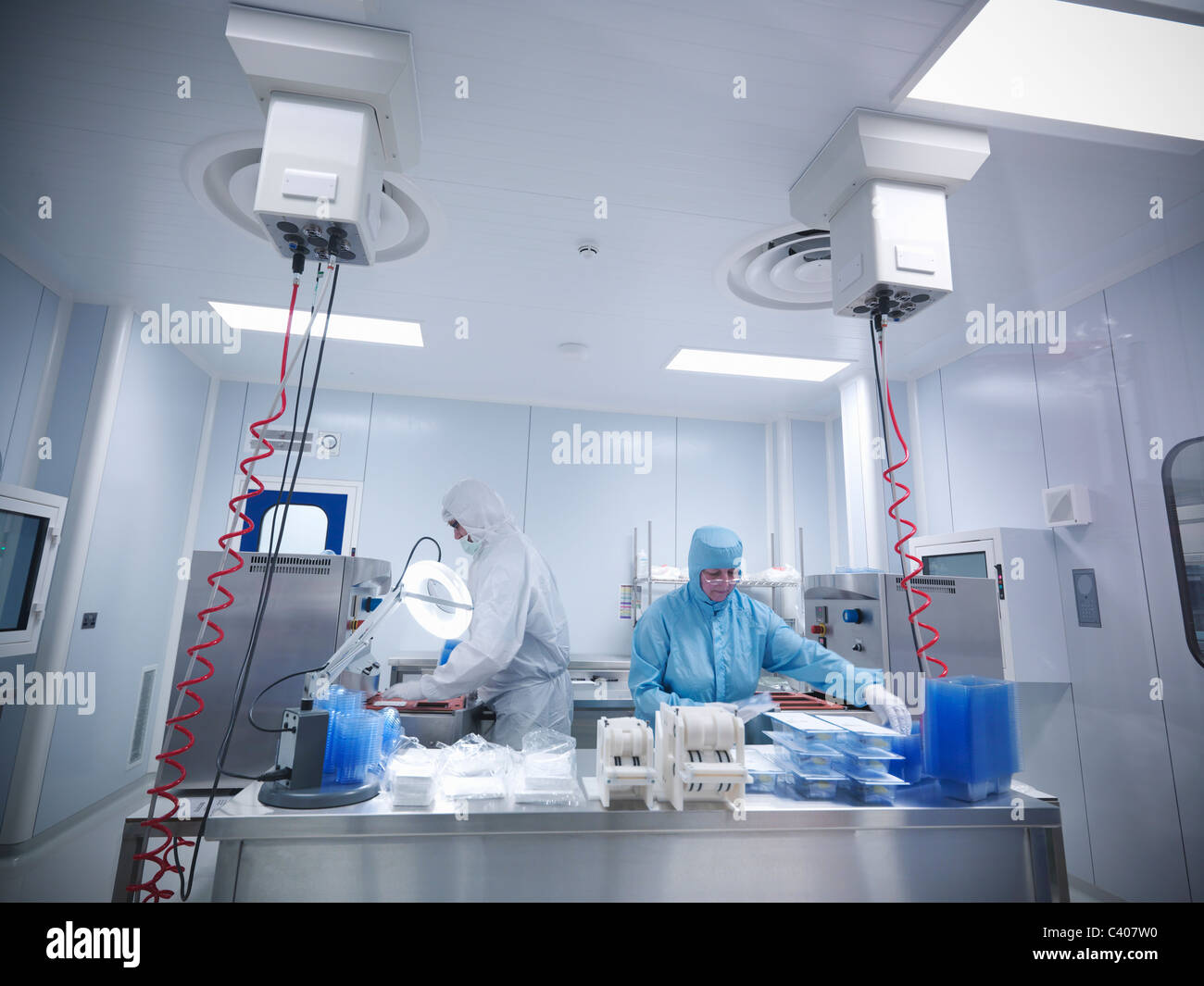 Scientists work in laboratory clean room Stock Photo - Alamy
