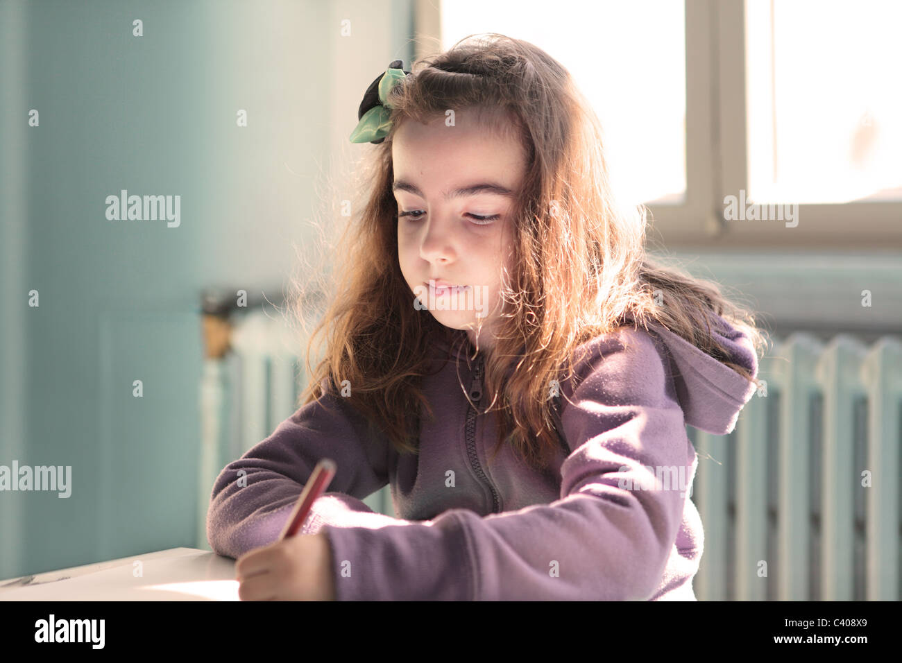 left-handed young school girl, writing Stock Photo - Alamy