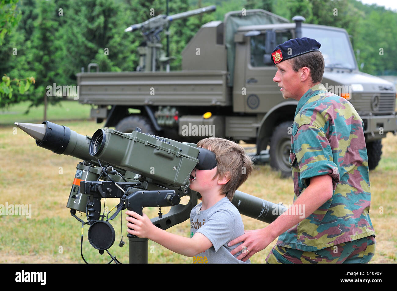 Soldier showing Mistral Air Defence Missile System to child during open ...