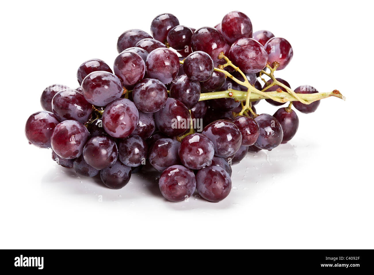 Close up of a bunch of red and juicy grapes on white background Stock ...