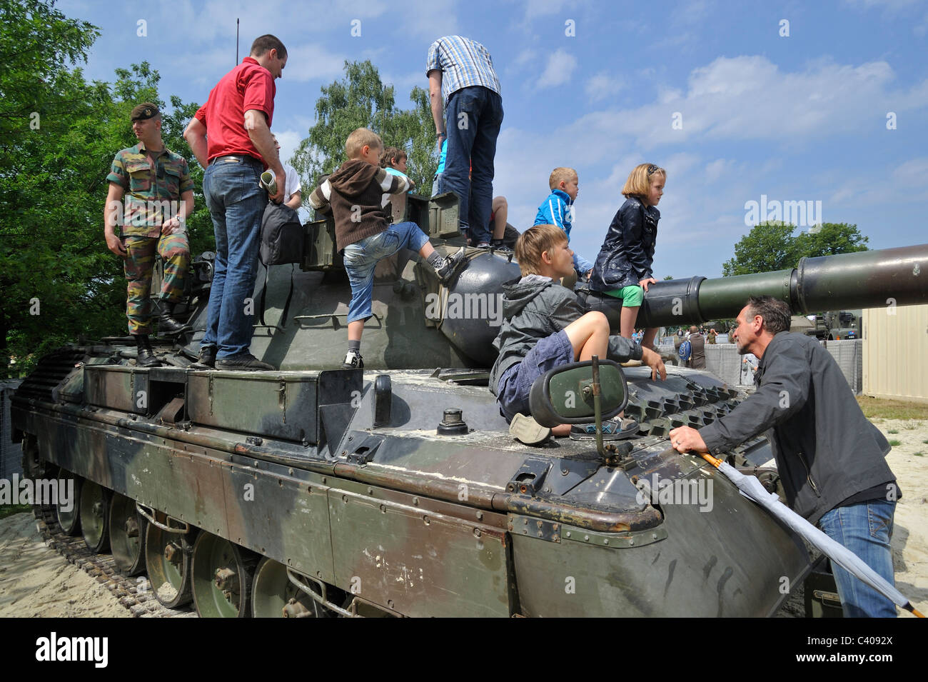 Visitors on Leopard 1 battle tank during open day of the Belgian army ...
