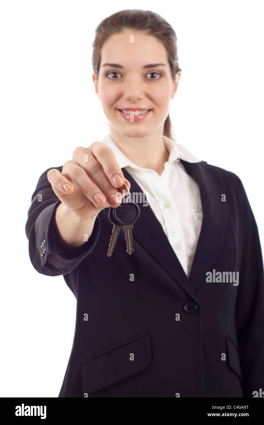 Happy business woman holding keys isolated over white background Stock ...