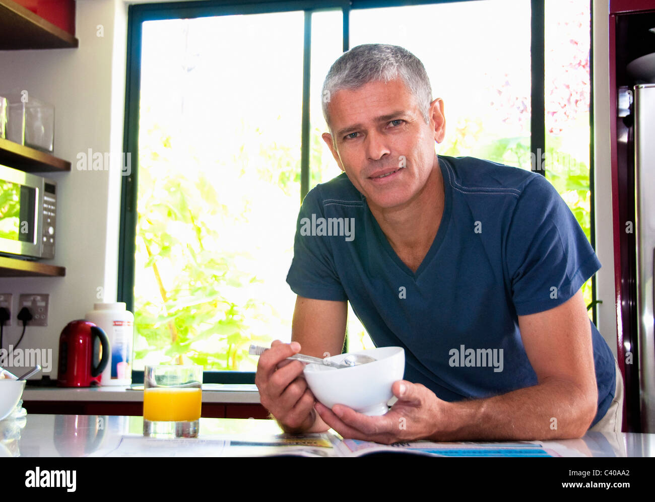 Home owner at breakfast Stock Photo - Alamy