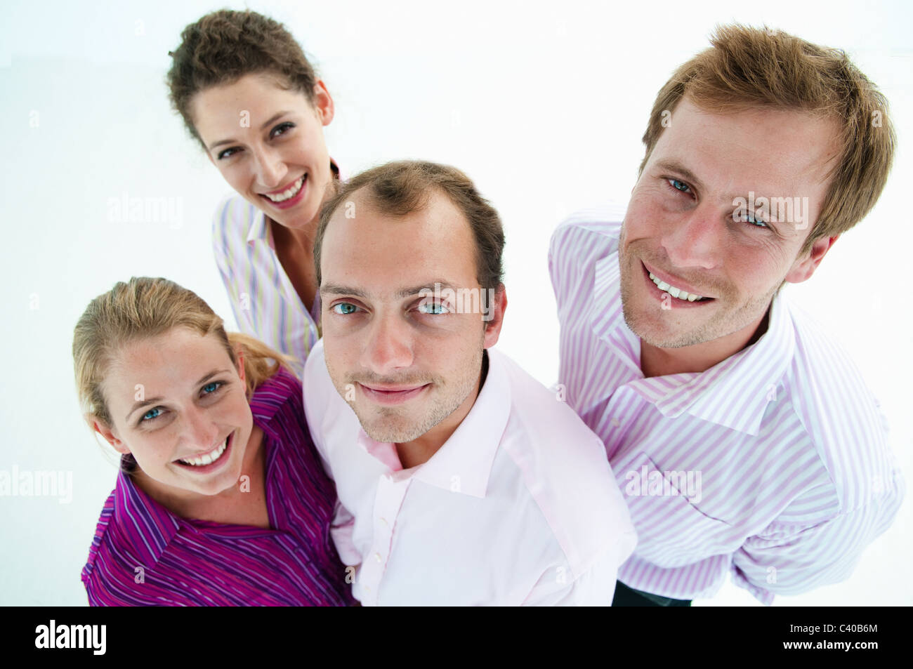 Happy business team look to camera Stock Photo - Alamy