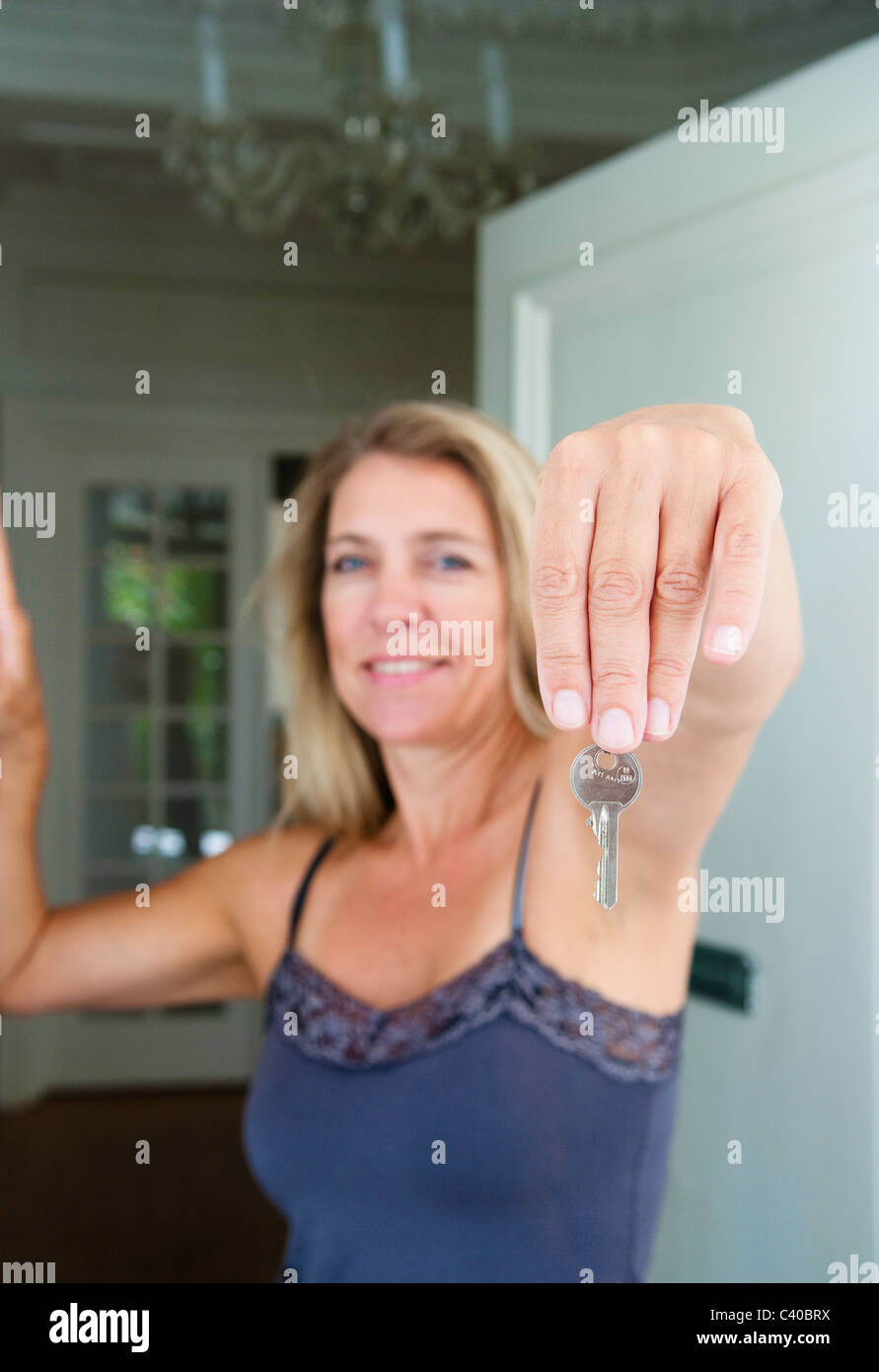 Woman with house keys Stock Photo - Alamy