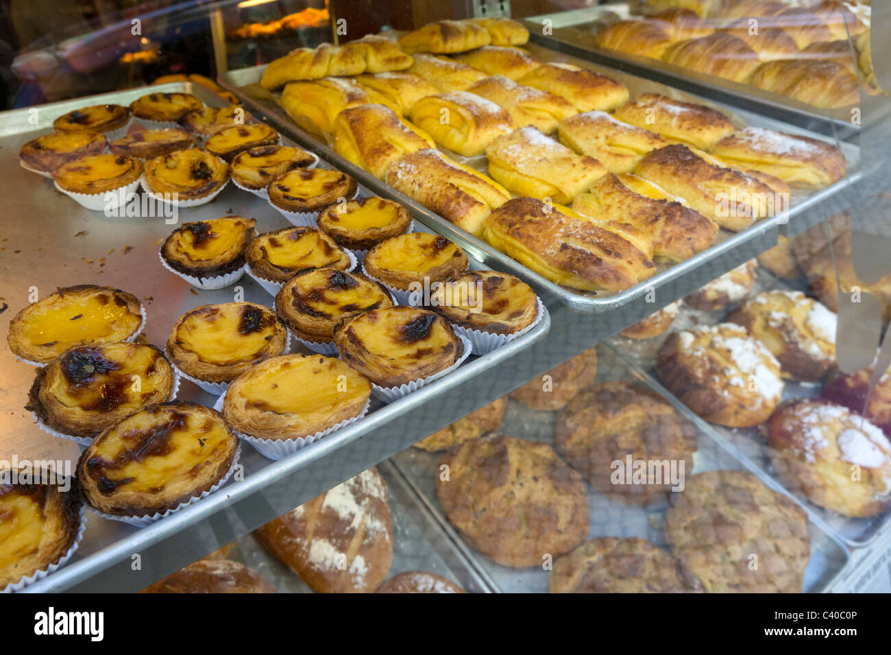 Cakes and sweets showcase in pastry shop window Stock Photo - Alamy