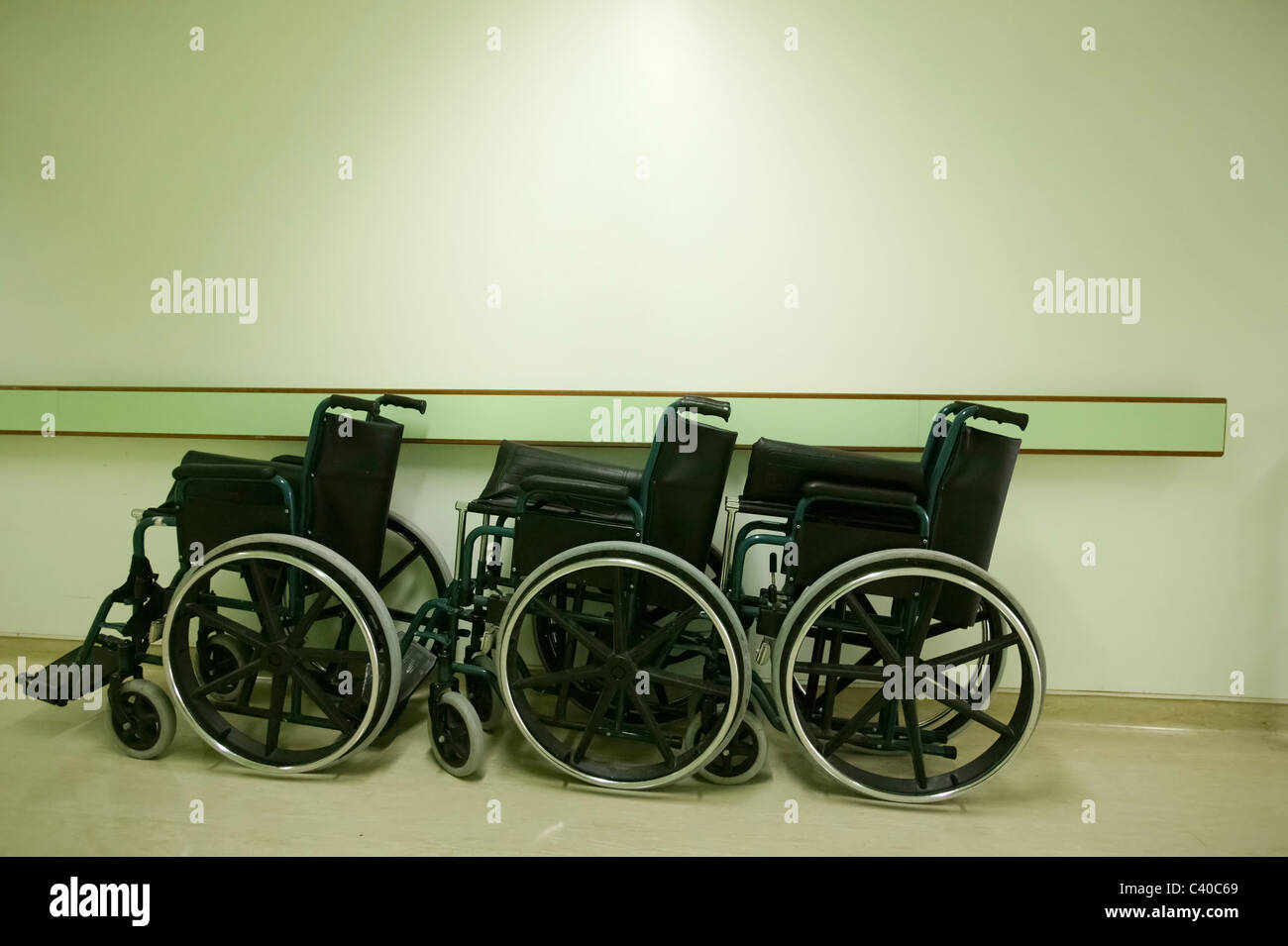 Three empty wheelchairs hi-res stock photography and images - Alamy