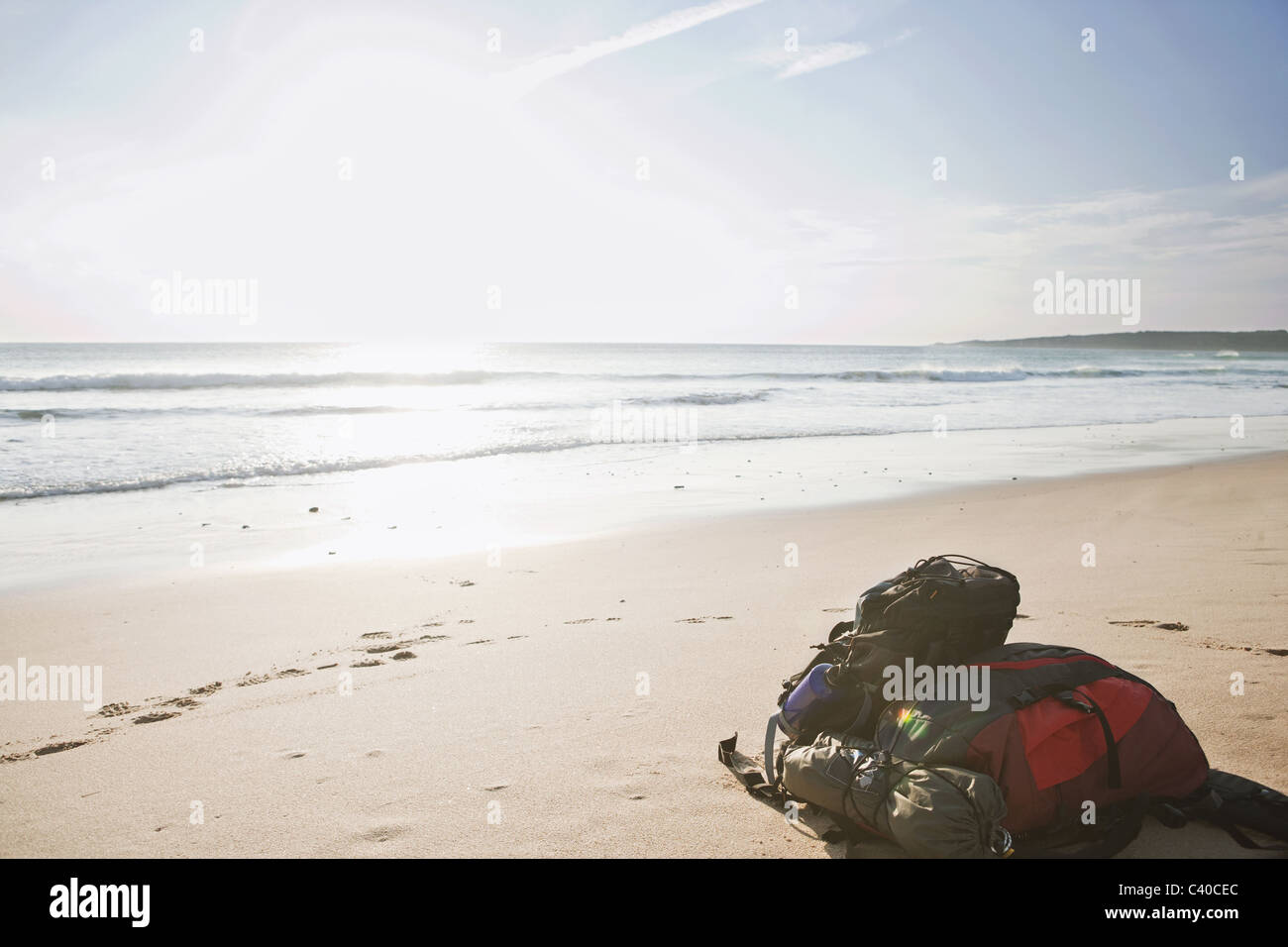 Two backpacks laid down on the beach Stock Photo - Alamy