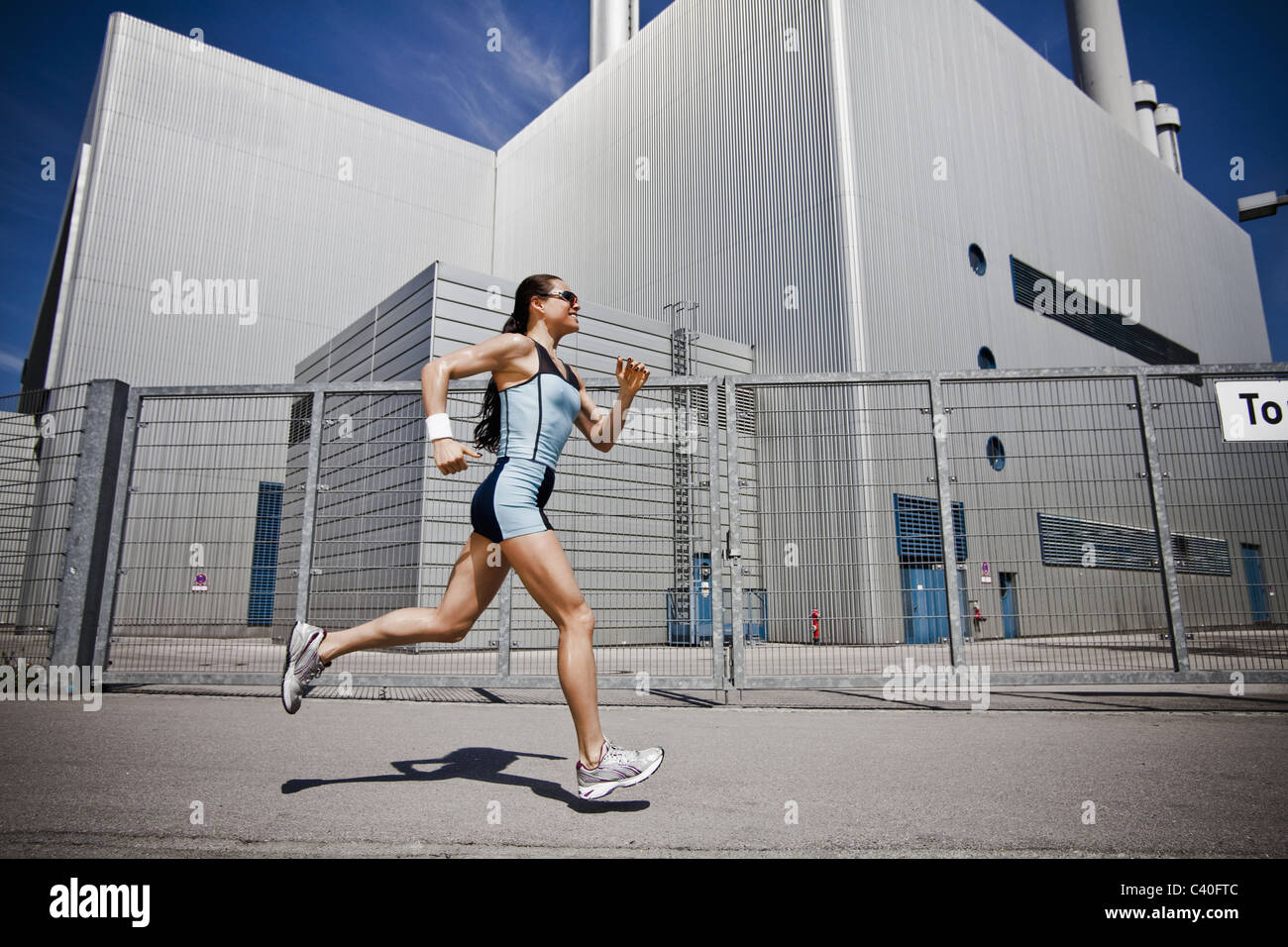 Woman running in city Stock Photo - Alamy