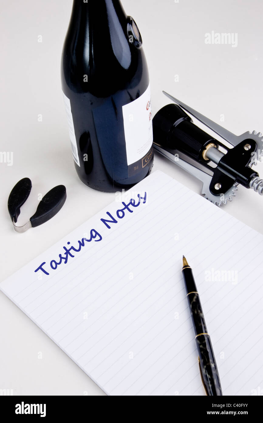 Wine bottle, opener and tasting notes Stock Photo - Alamy