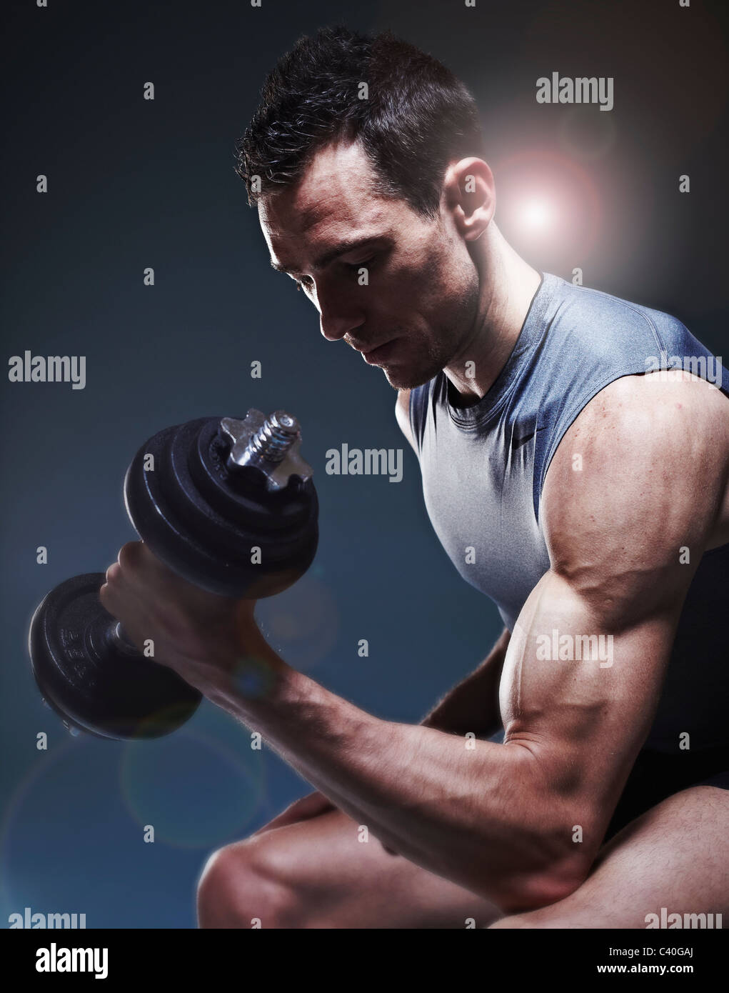 Man doing weights Stock Photo - Alamy