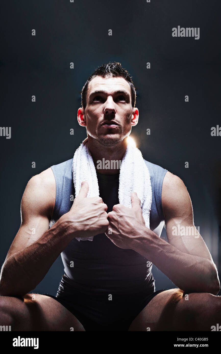 Man with a towel around his neck Stock Photo - Alamy