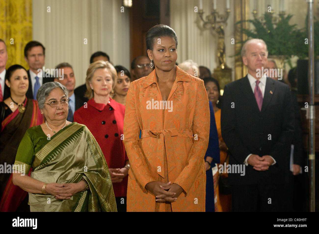 First Lady Michele Obama waits for U.S. President Barack Obama to ...