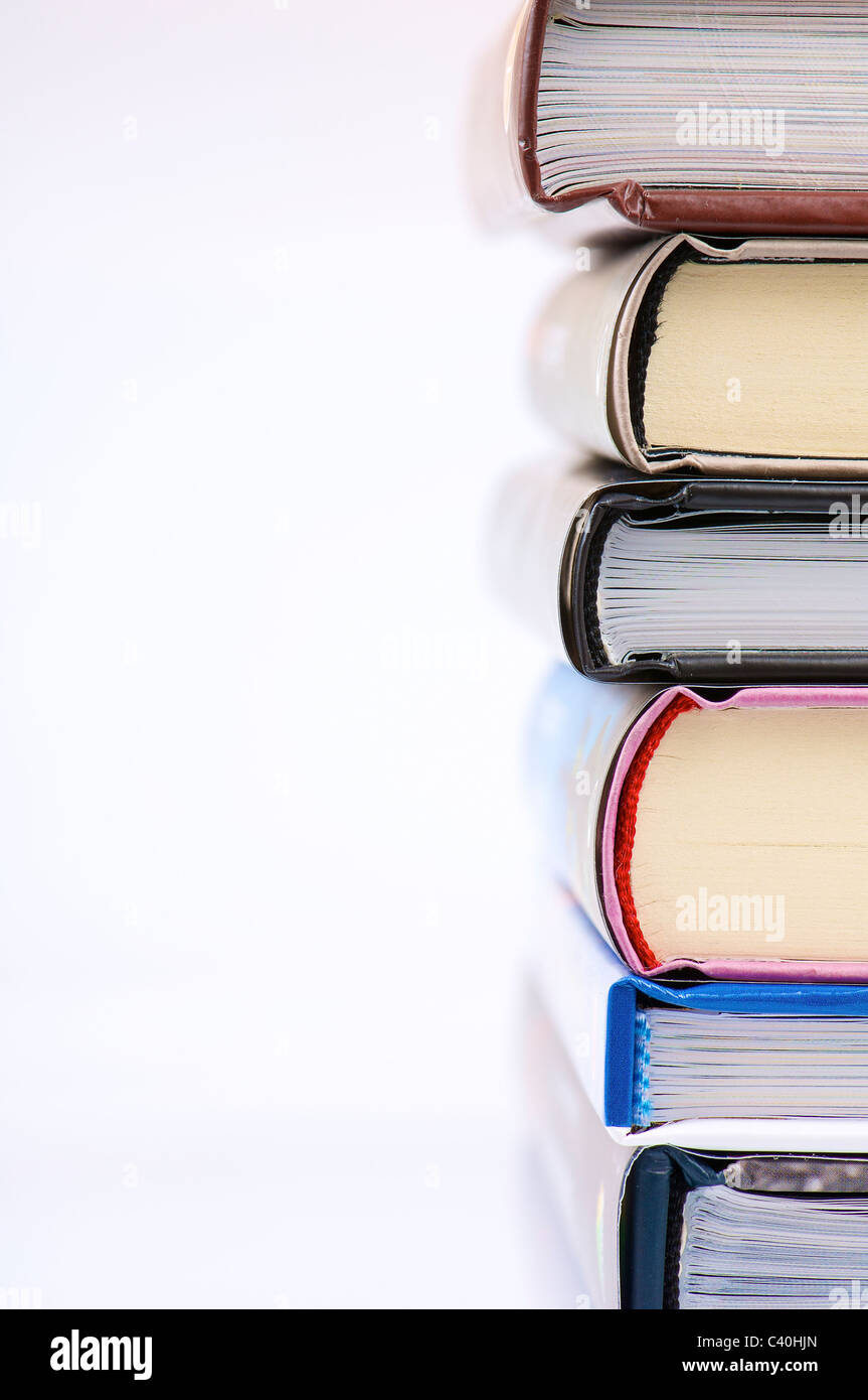 forefront of a group of books stacked Stock Photo - Alamy