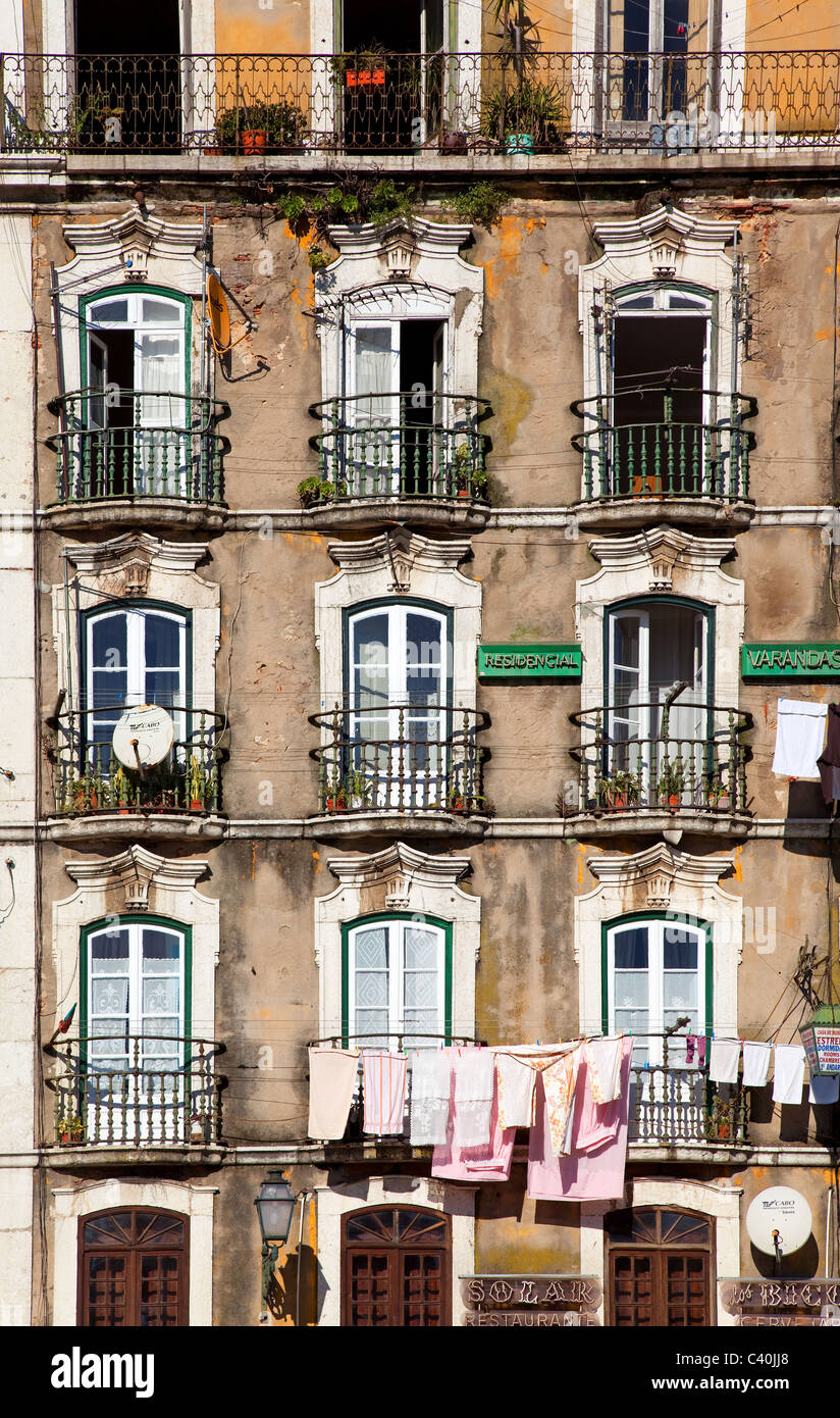 Old and damaged neoclassical building in lower Alfama district. Typical ...