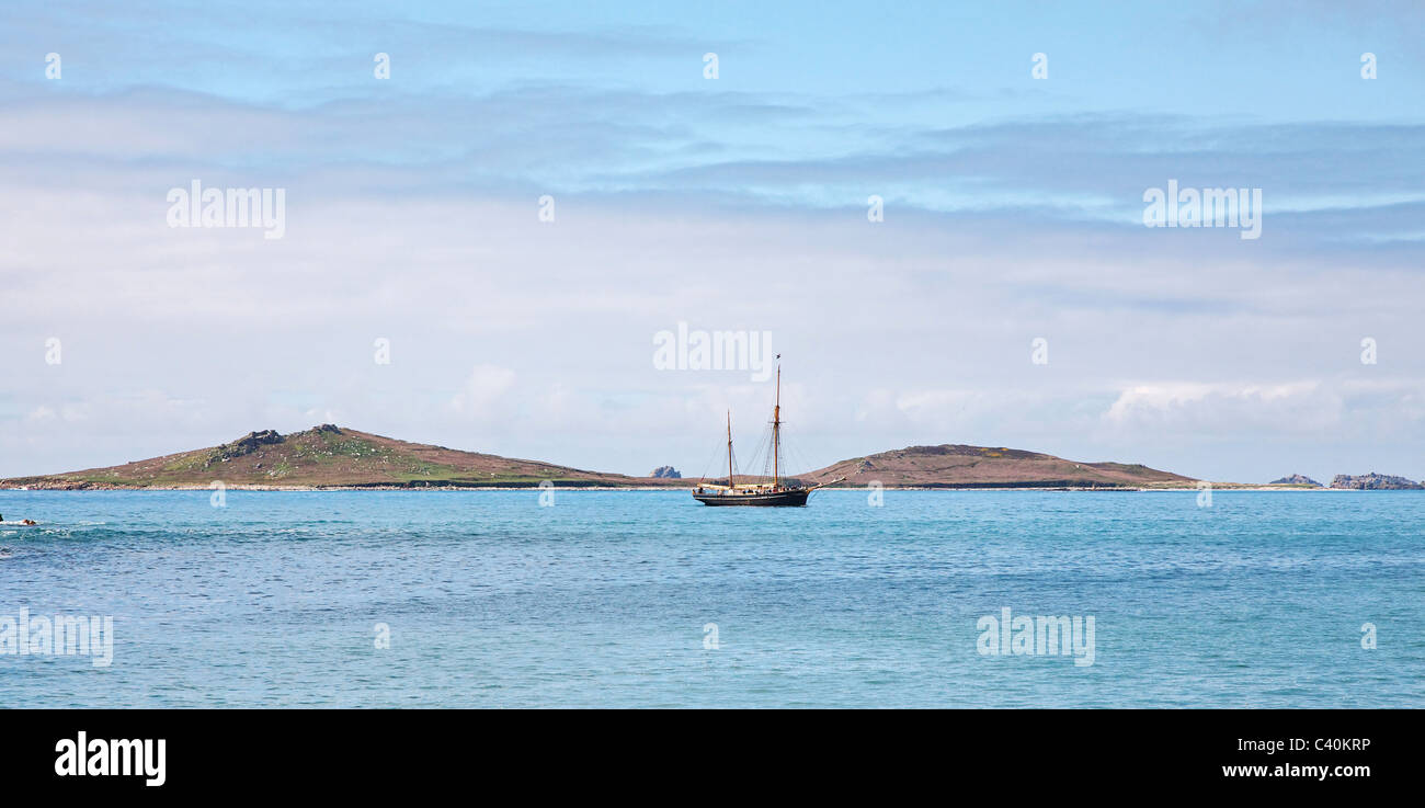 Double masted sailing vessel cruising past Samson island towards St ...