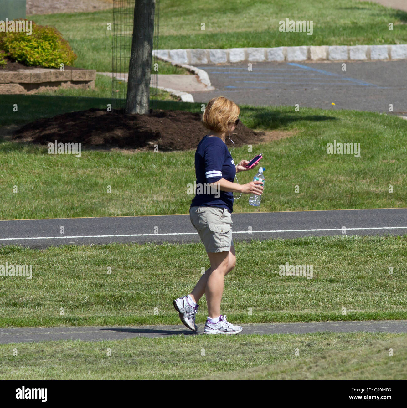 Girl exercising with mp3 player hi-res stock photography and images - Alamy