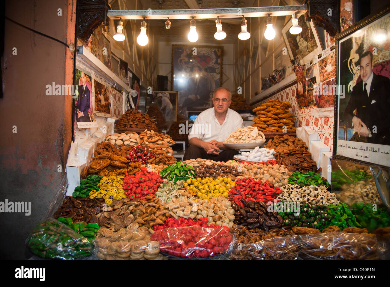 Sweet seller inside the medieval souk Marrakech Stock Photo - Alamy