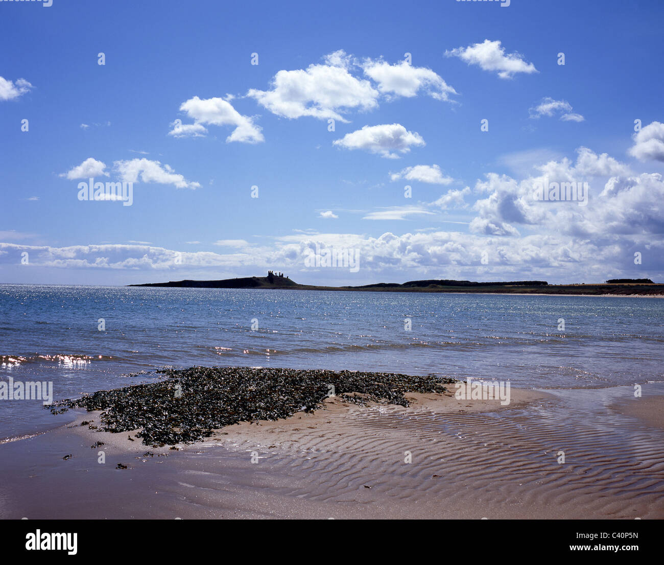 Dunstanburgh Castle from the sandy beach at Embleton Bay Embleton ...