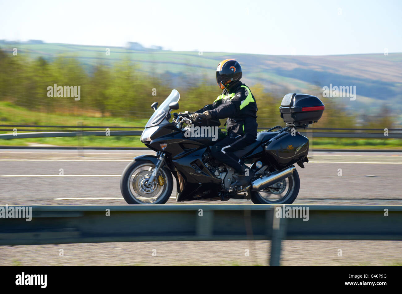 Biker on the M62 motorway (near Outlane, Huddersfield Stock Photo - Alamy