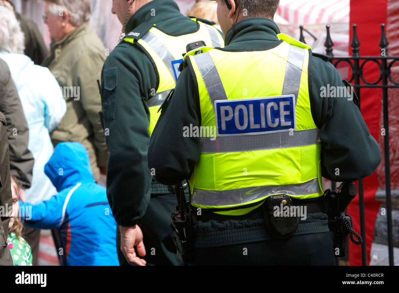 Police officers walking through crowded hi-res stock photography and ...