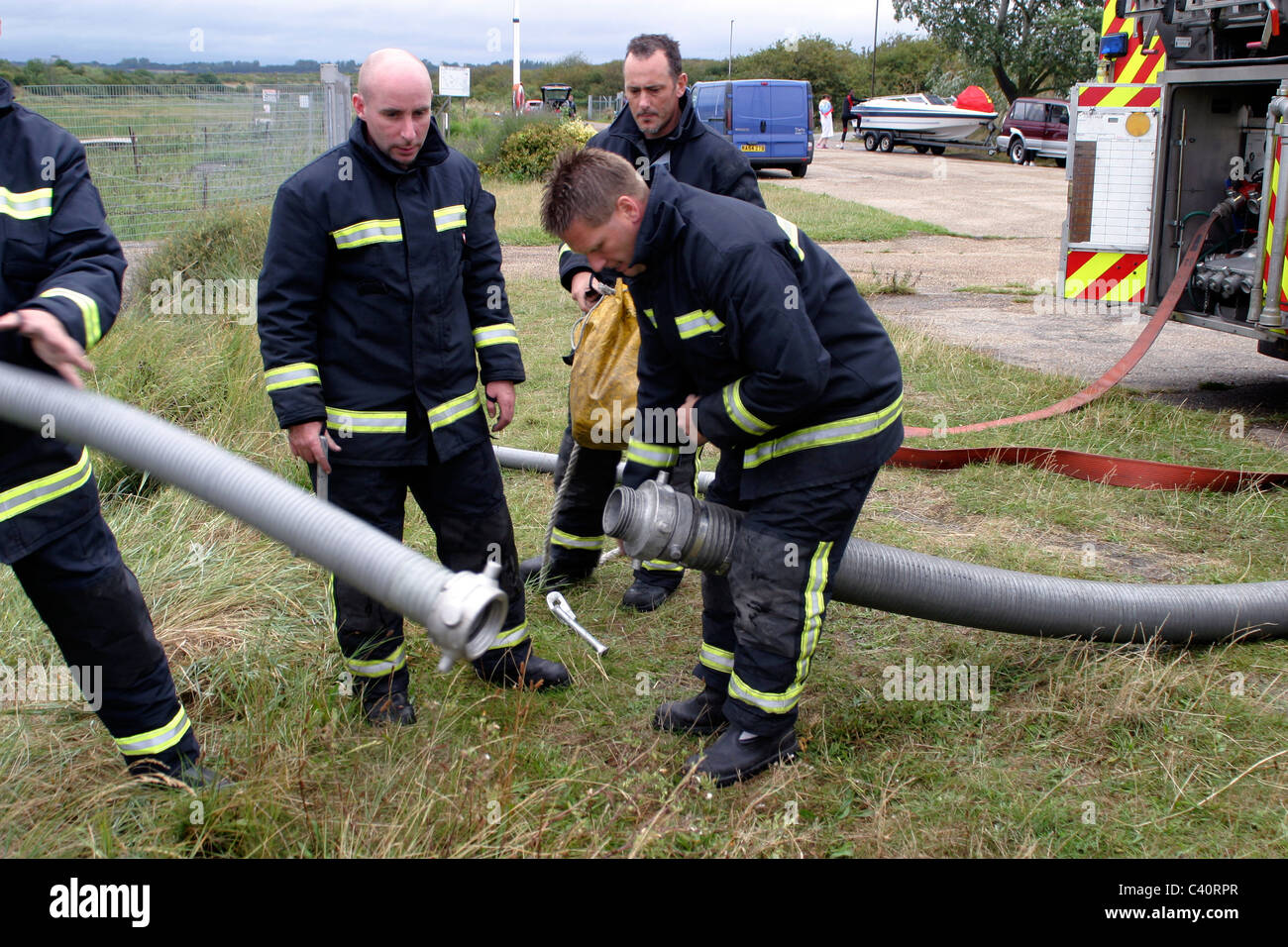 Firefighters training to pump water from a river Stock Photo - Alamy