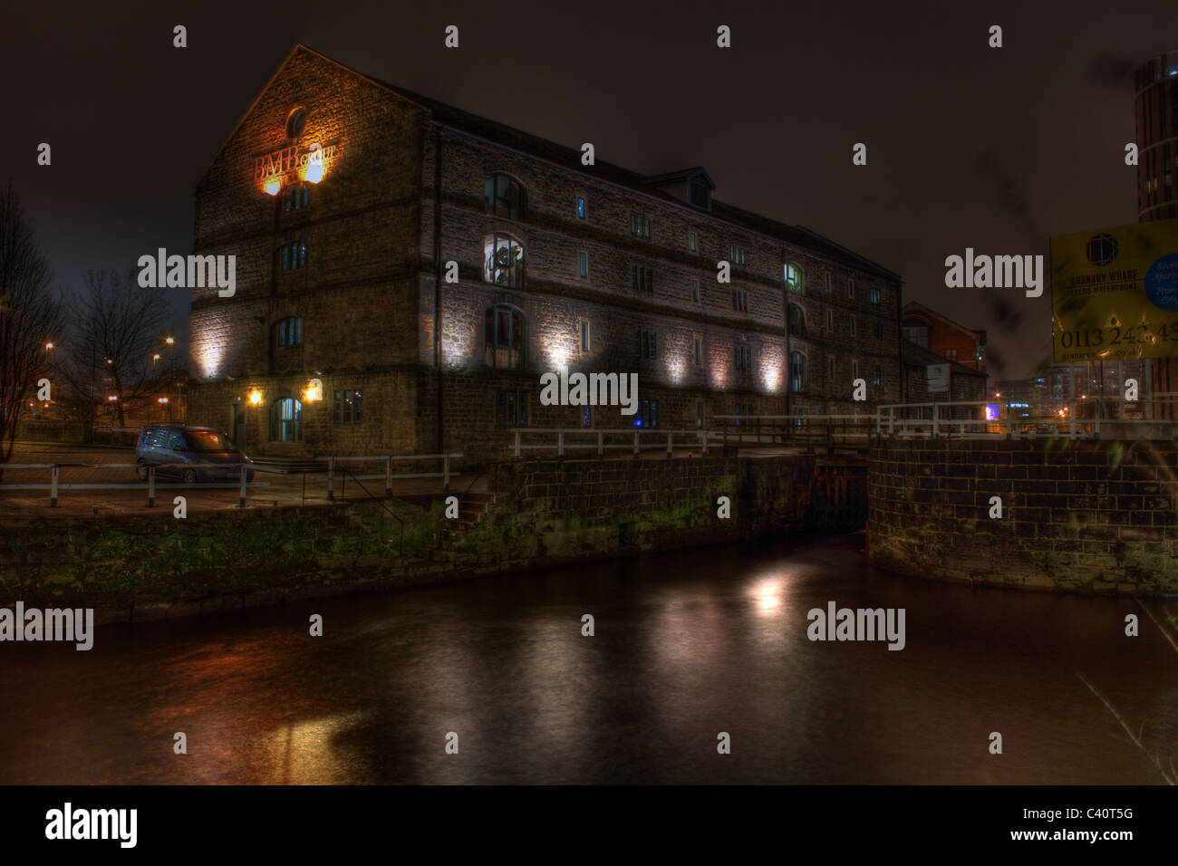 old mill conversion at night Stock Photo - Alamy