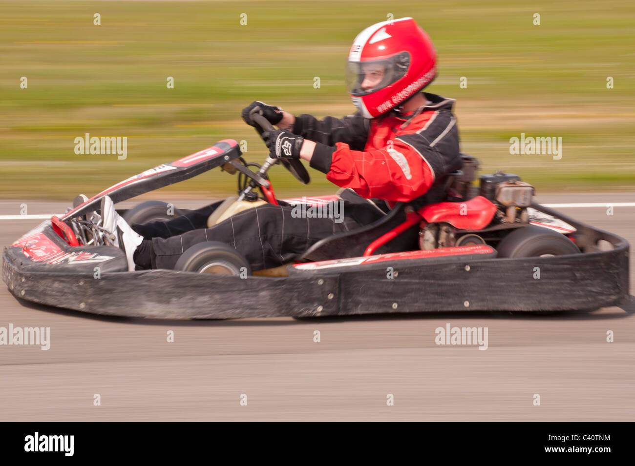 A petrol powered Go cart showing deliberate motion blur on a race track ...