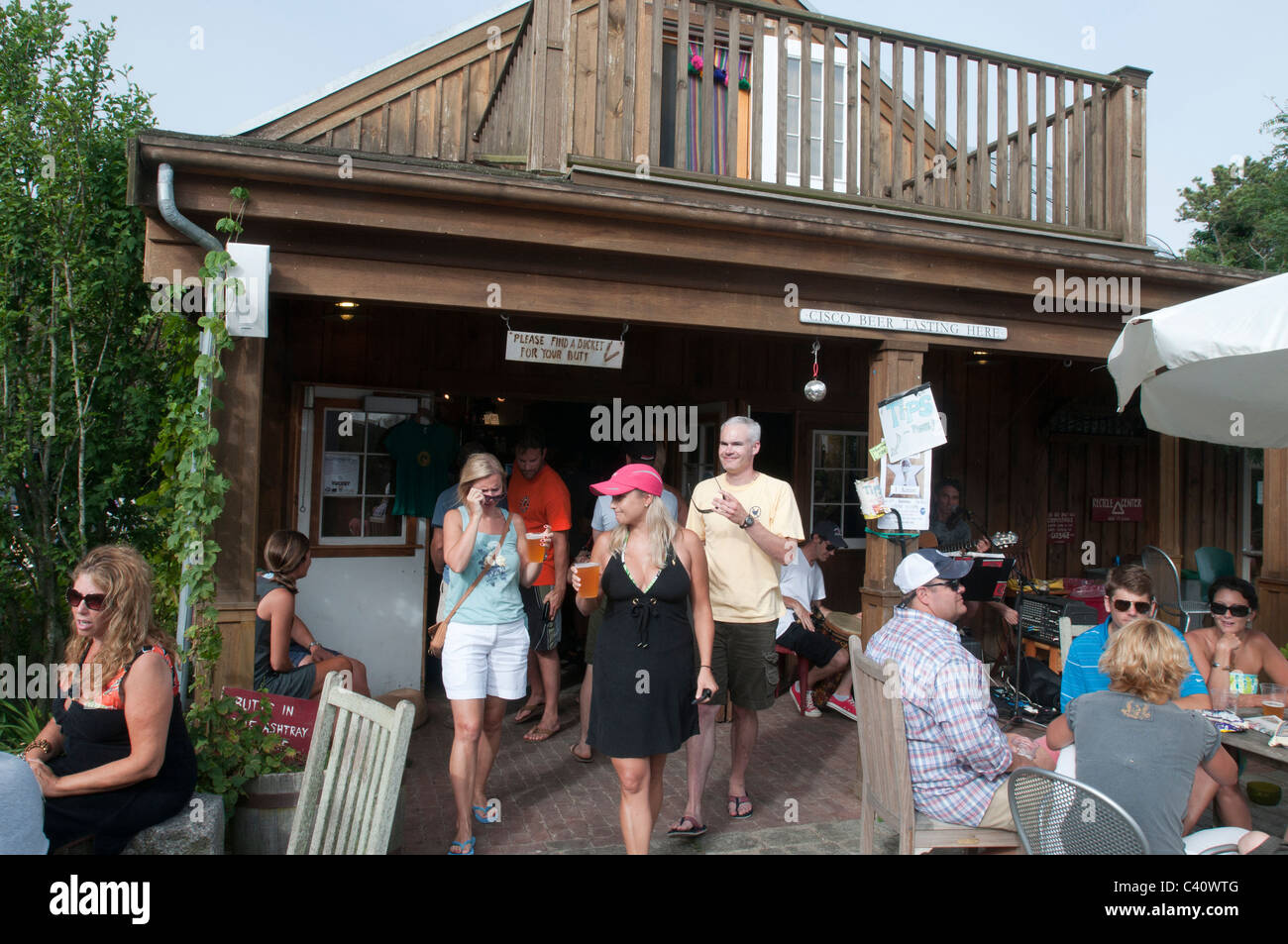 People gather outside Cisco Brewers Nantucket Island Stock Photo - Alamy