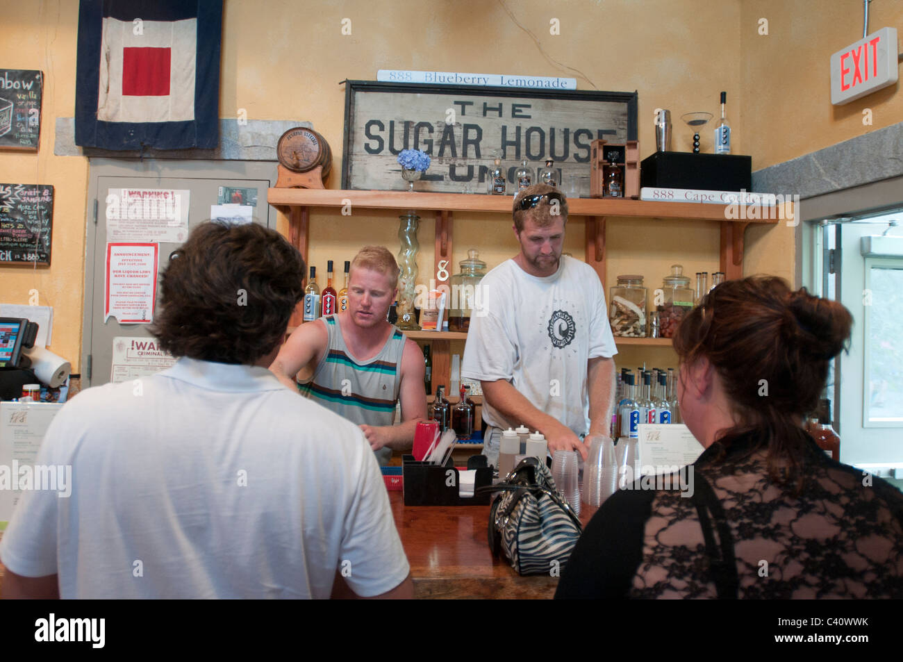 Bartenders serve drinks the Nantucket Triple Eight Distillery Stock ...