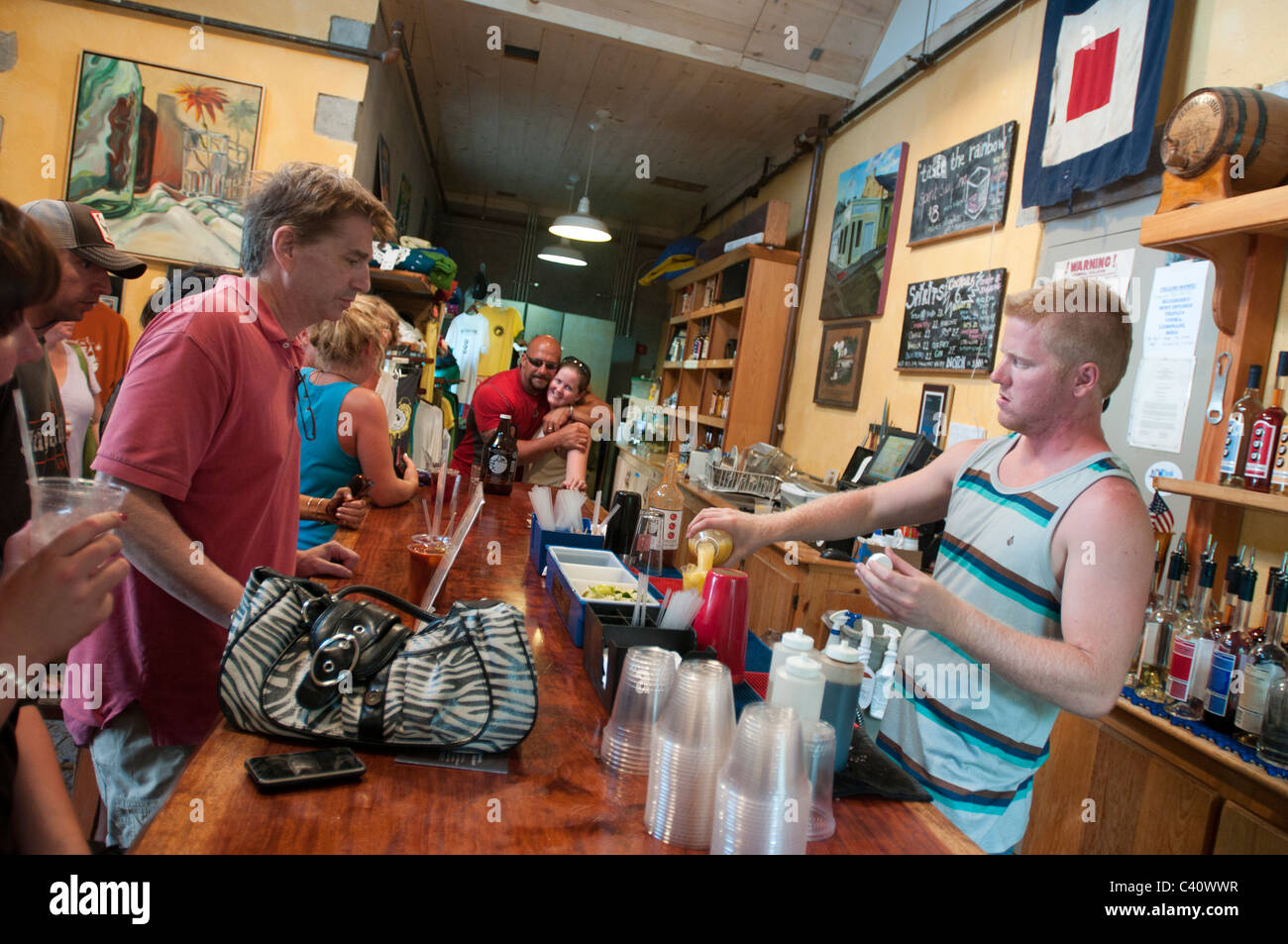 Bartenders serve drinks the Nantucket Triple Eight Distillery Stock ...