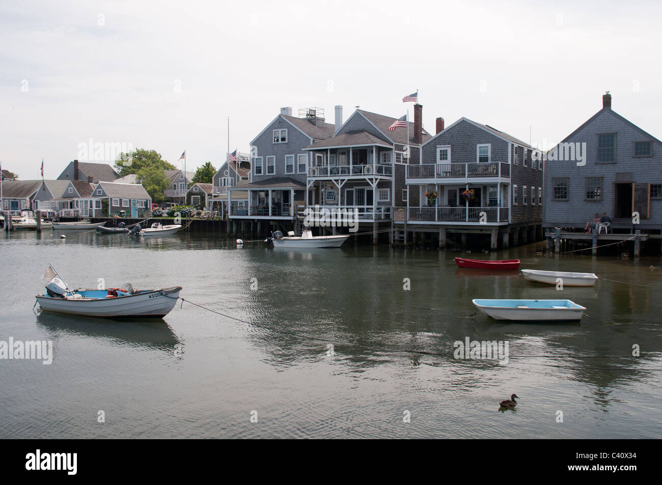 Homes and boat on the Nantucket Town harbor Stock Photo - Alamy