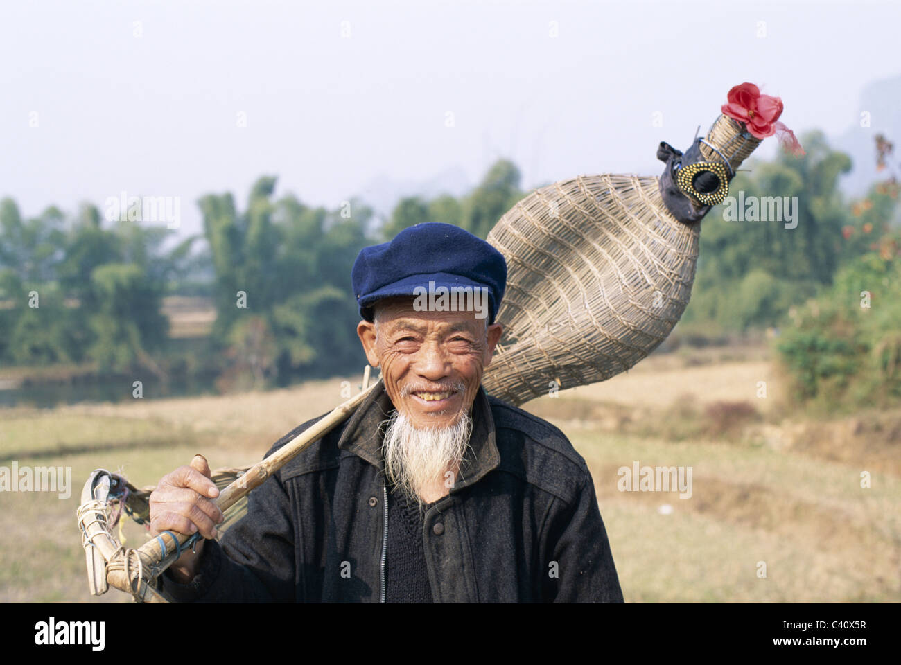 Elderly fish farmer traditional fishing hi-res stock photography and ...