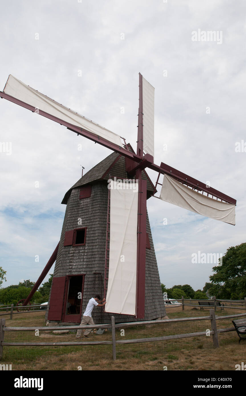 A man push starts a windmill on Nantucket Island Stock Photo - Alamy