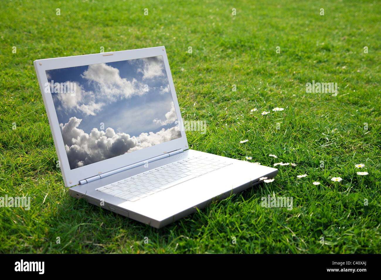 White laptop in park Stock Photo - Alamy