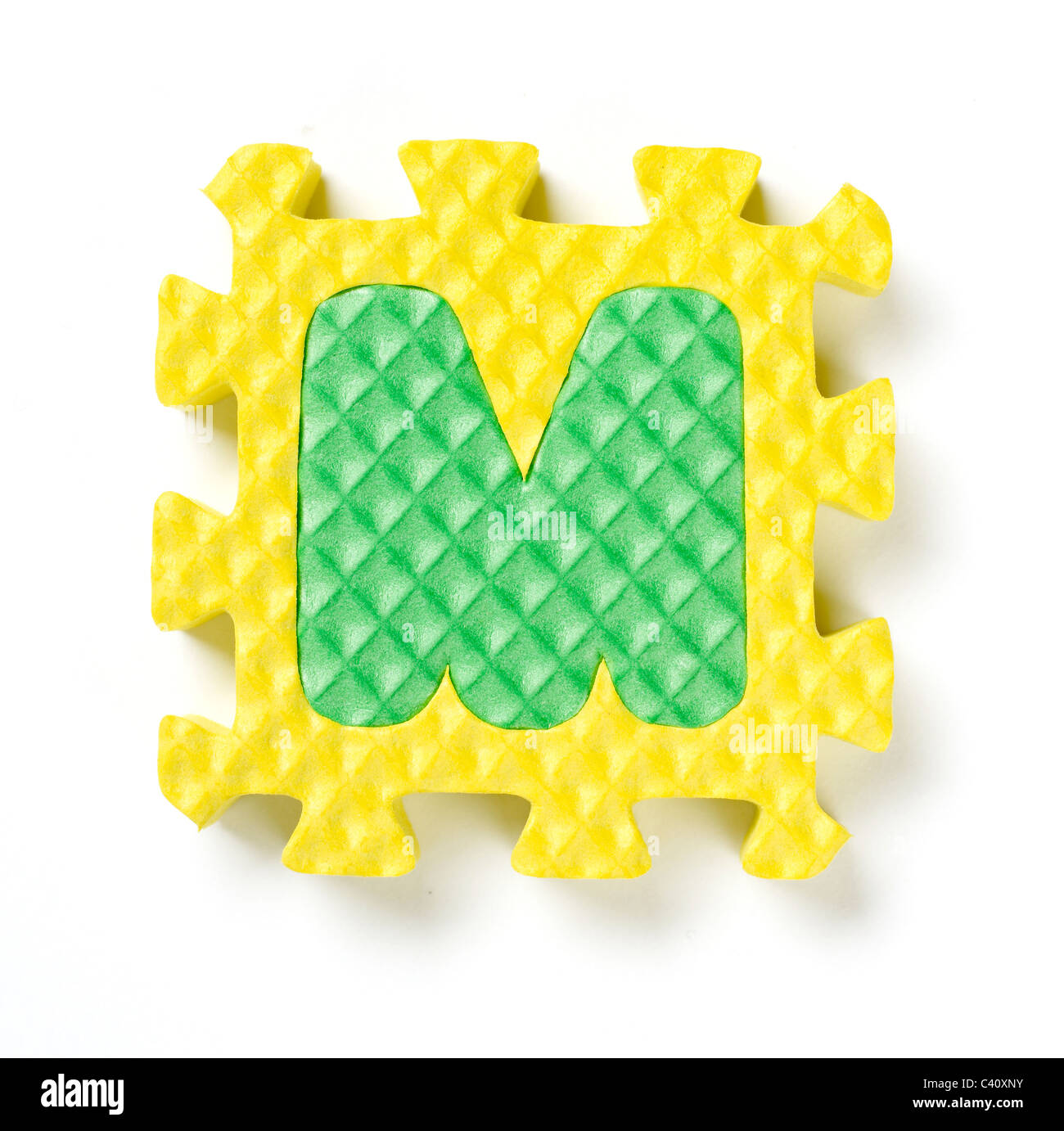 alphabet puzzle piece M Stock Photo - Alamy
