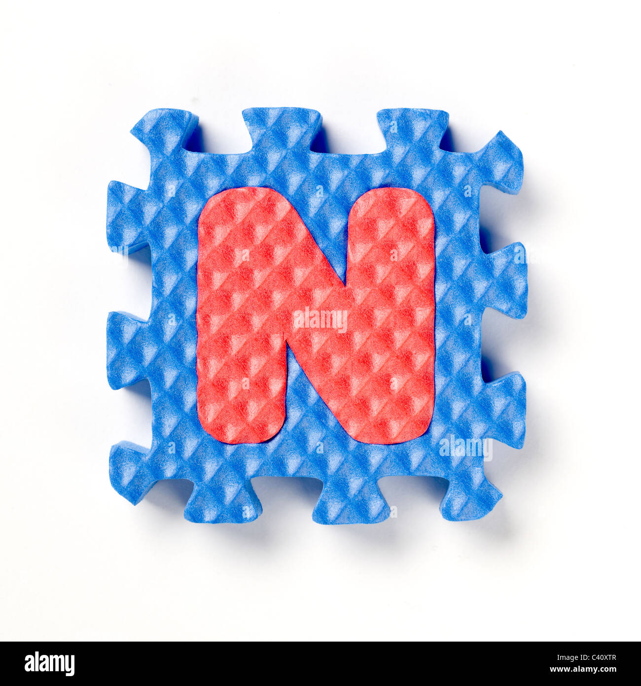 alphabet puzzle piece N Stock Photo - Alamy