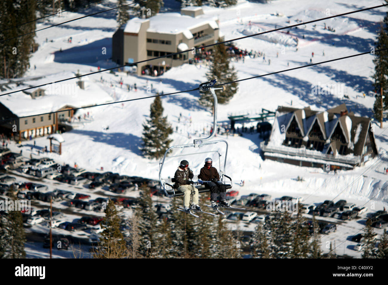 Skiers riding the chairlift at Brighton ski resort. Salt Lake City ...
