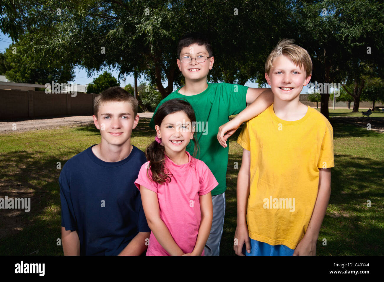 Four kids together outside Stock Photo - Alamy