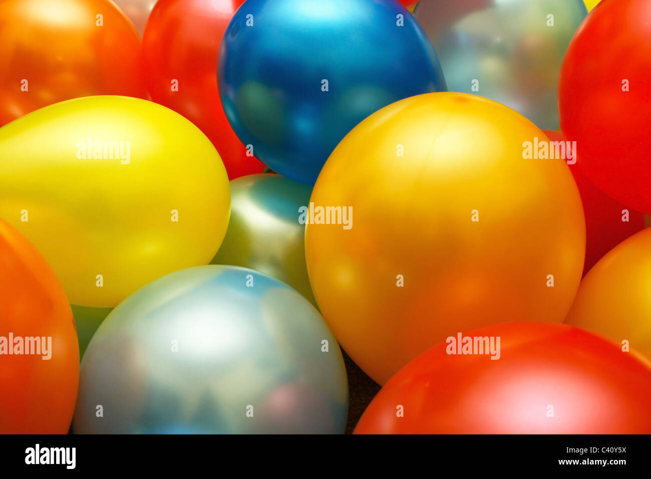 Multi colored balloons together Stock Photo - Alamy