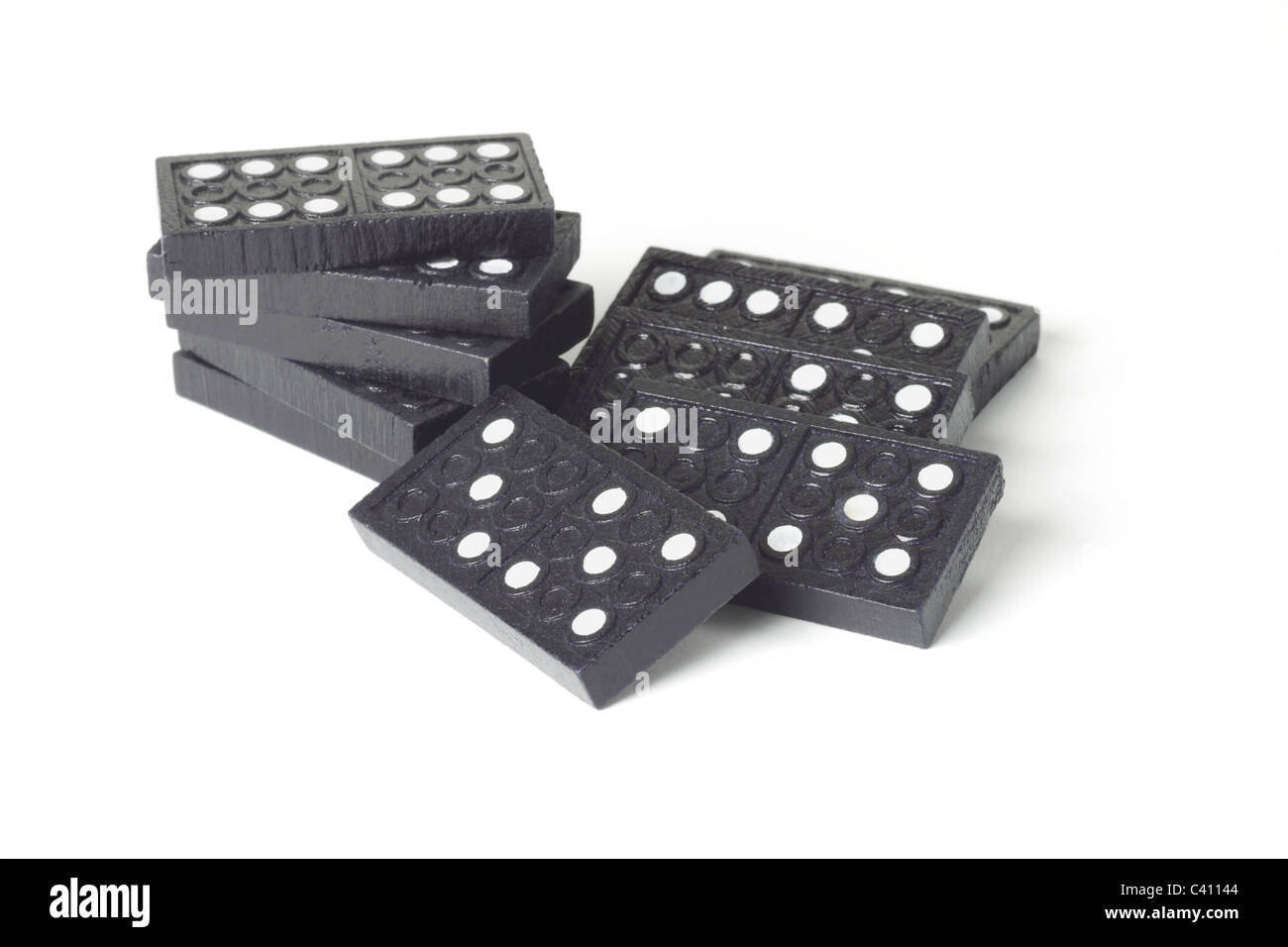 Black wooden domino blocks on white background Stock Photo - Alamy