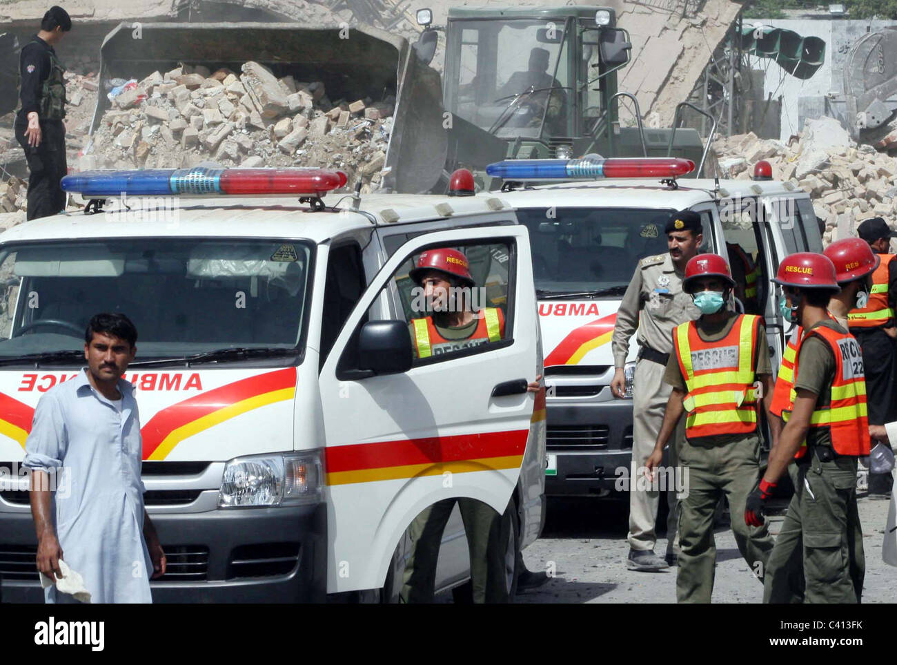 Rescue ambulances gather at the site of explosion during rescue ...