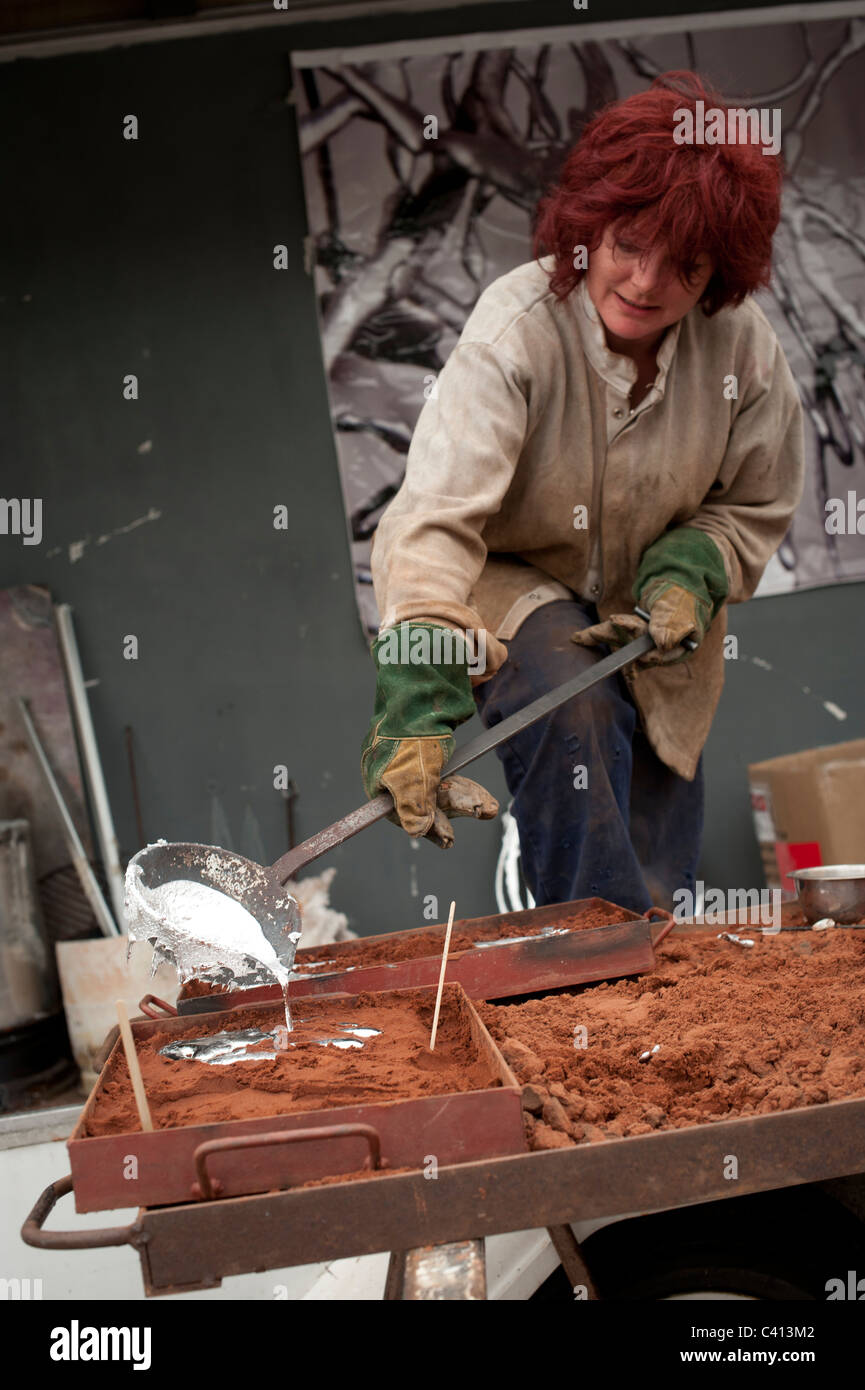 Artist DAWNY TOOTES Casting sculptures using molten aluminium made from ...