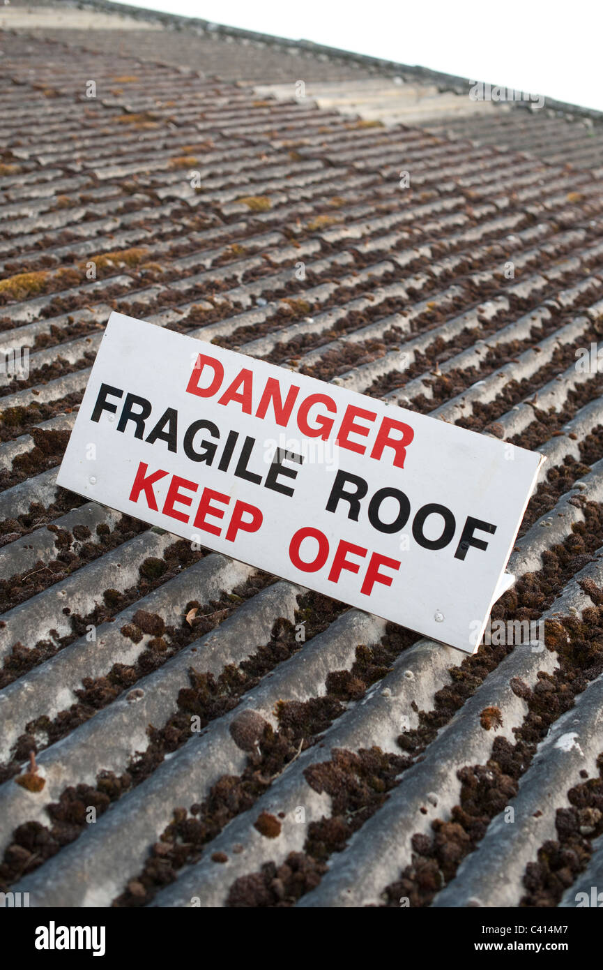 Danger fragile roof keep off sign uk Stock Photo - Alamy