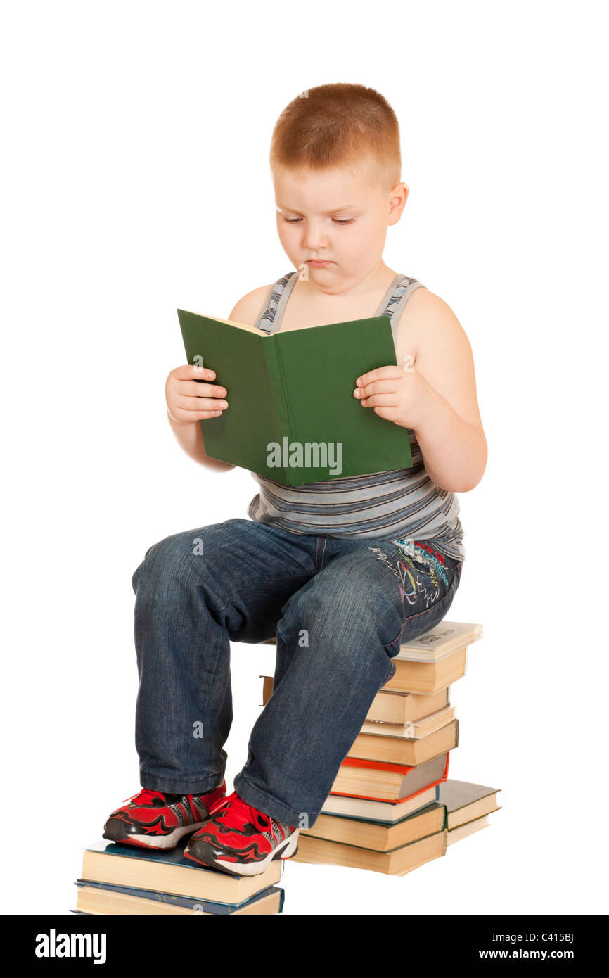 little boy reading a book isolated on white background Stock Photo - Alamy