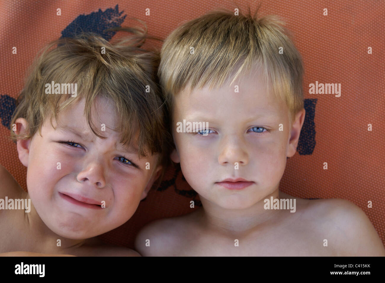 two boys, one is crying Stock Photo - Alamy