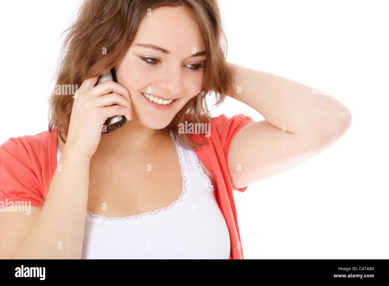 Attractive young woman taking a phone call. All on white background ...